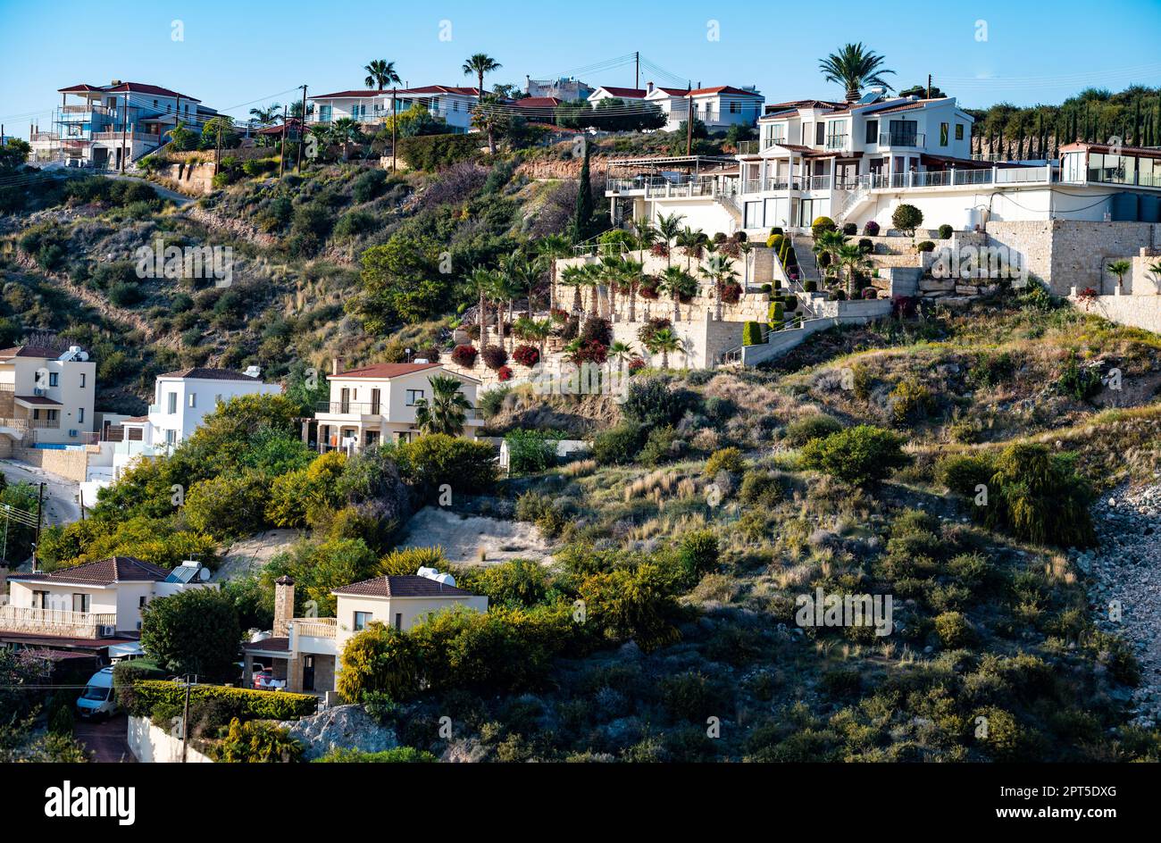 Peyia, Cyprus, March 26 , 2023 - White village houses in the hills and ...