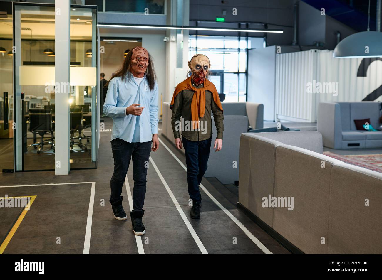 Confident experienced zombie employees working at modern office open ...