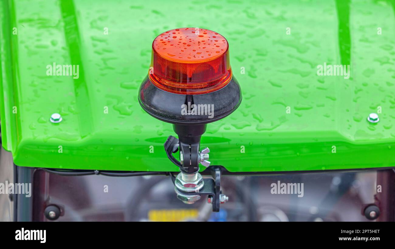 Amber Dome Led Light at Green Machine Roof Wet Rain Stock Photo - Alamy