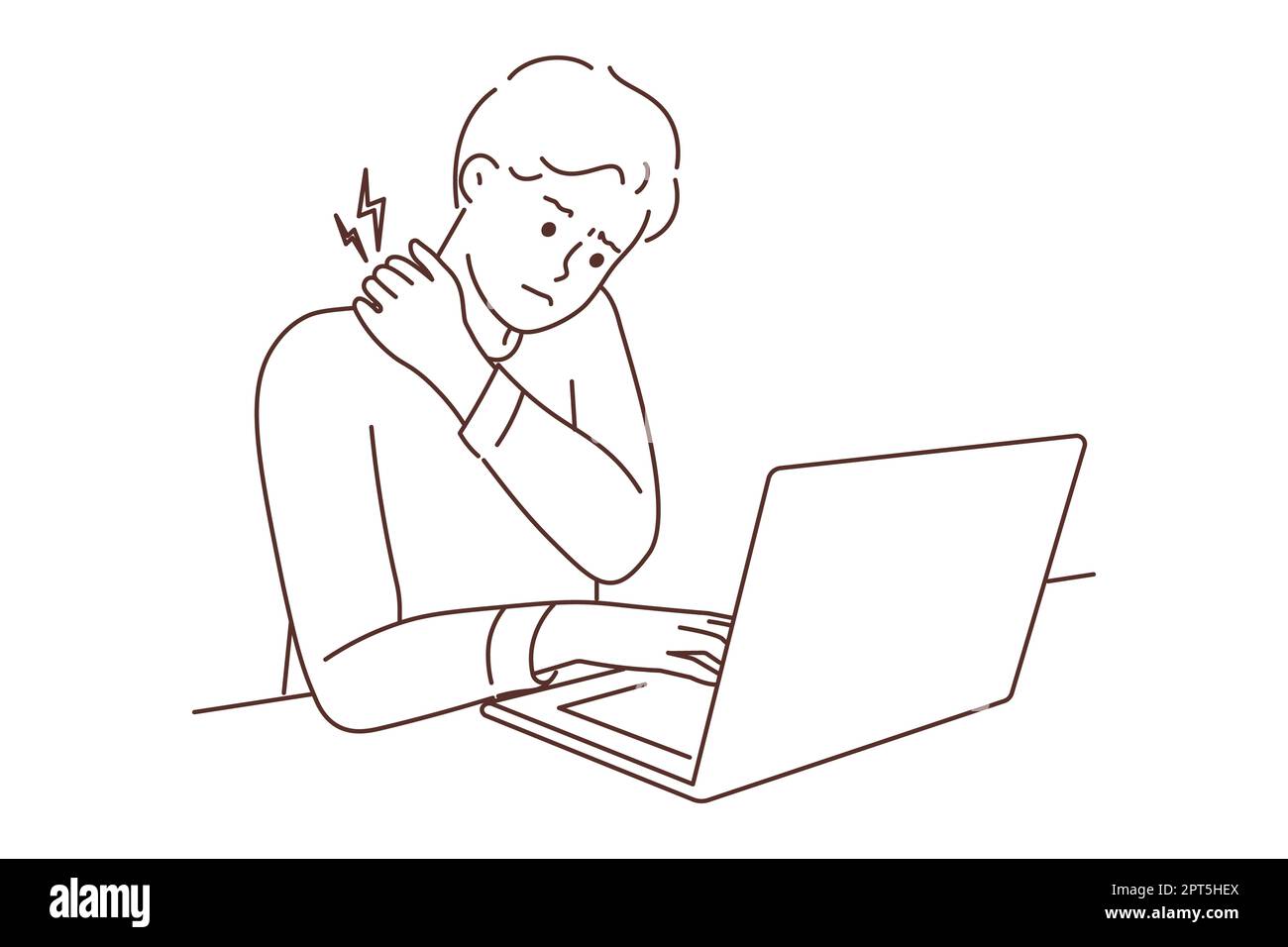 Tired young man sit on desk working on computer suffering from backache ...