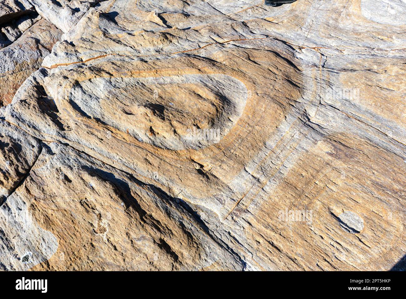 unusual rock formations of the volcanic cliff on Cala Sapone beach ...