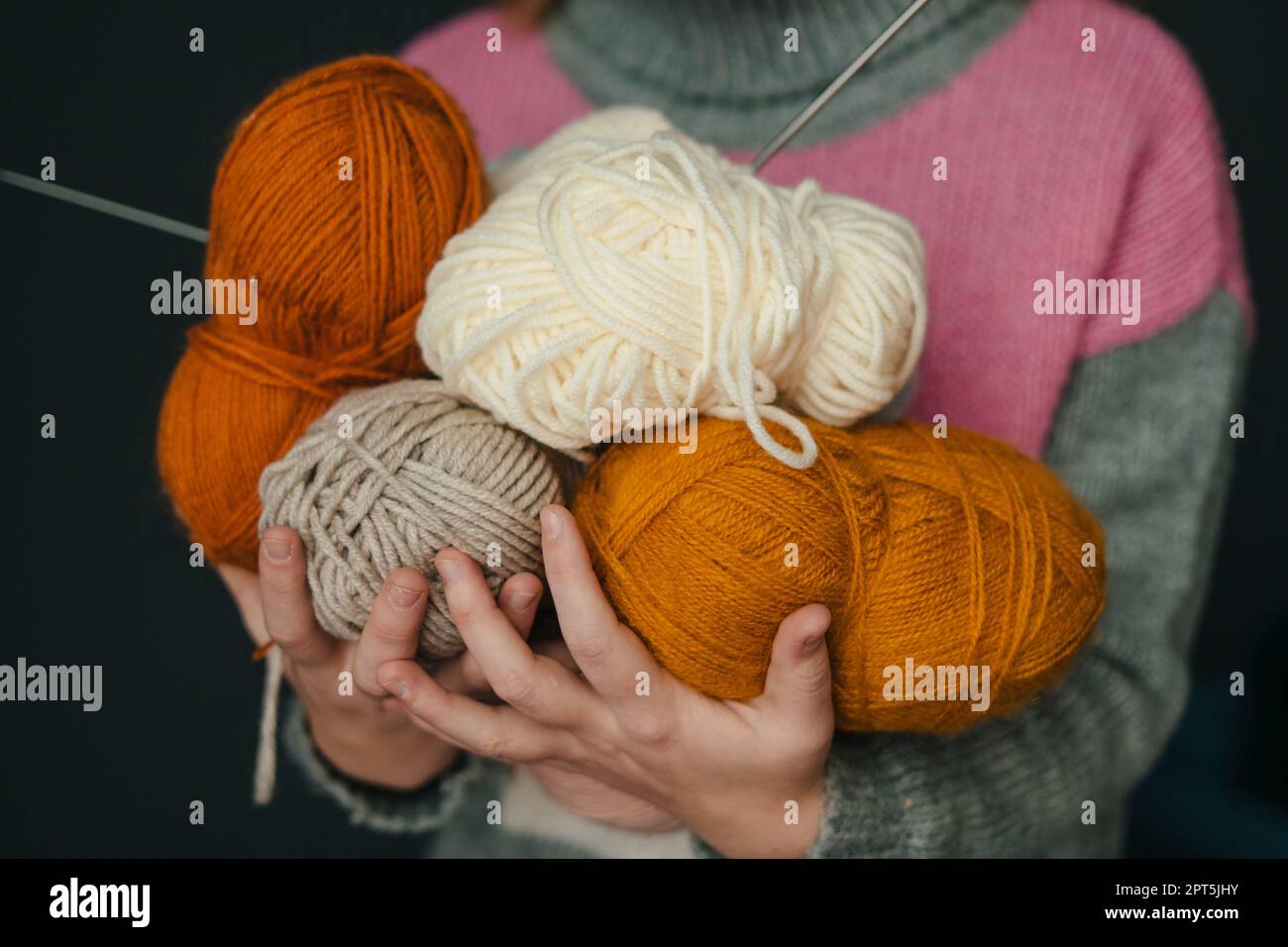 Woman's hands holding colored balls of yarn for knitting isolated over ...