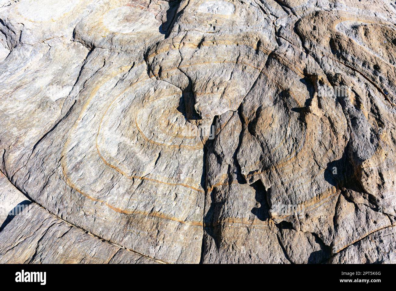unusual rock formations of the volcanic cliff on Cala Sapone beach ...