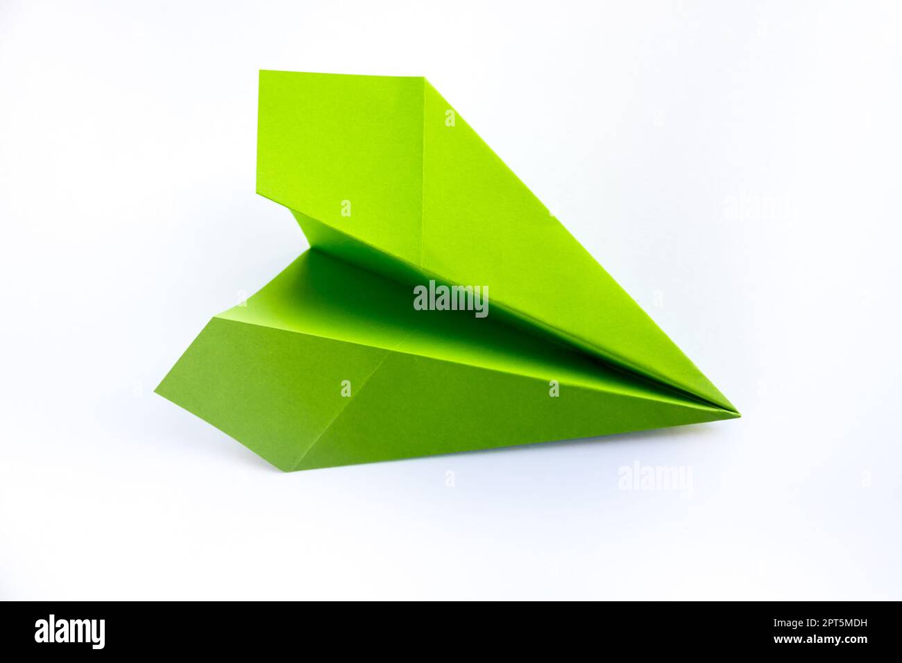 Green paper plane origami isolated on a blank white background Stock ...