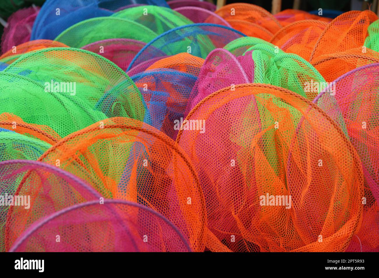 Full frame image of assorted nylon fishing nets in bright colours Stock ...