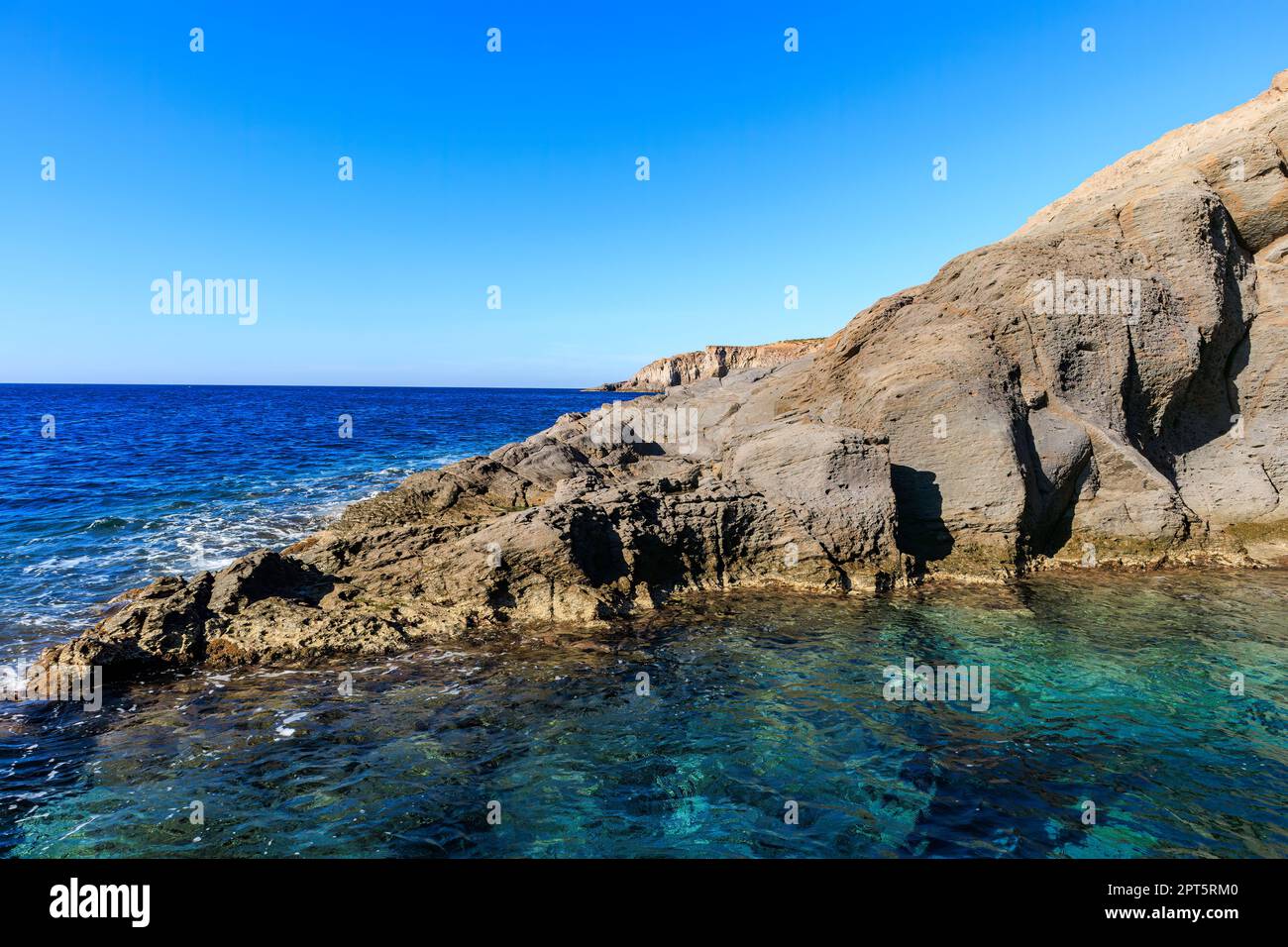 unusual rock formations of the volcanic cliff on Cala Sapone beach ...