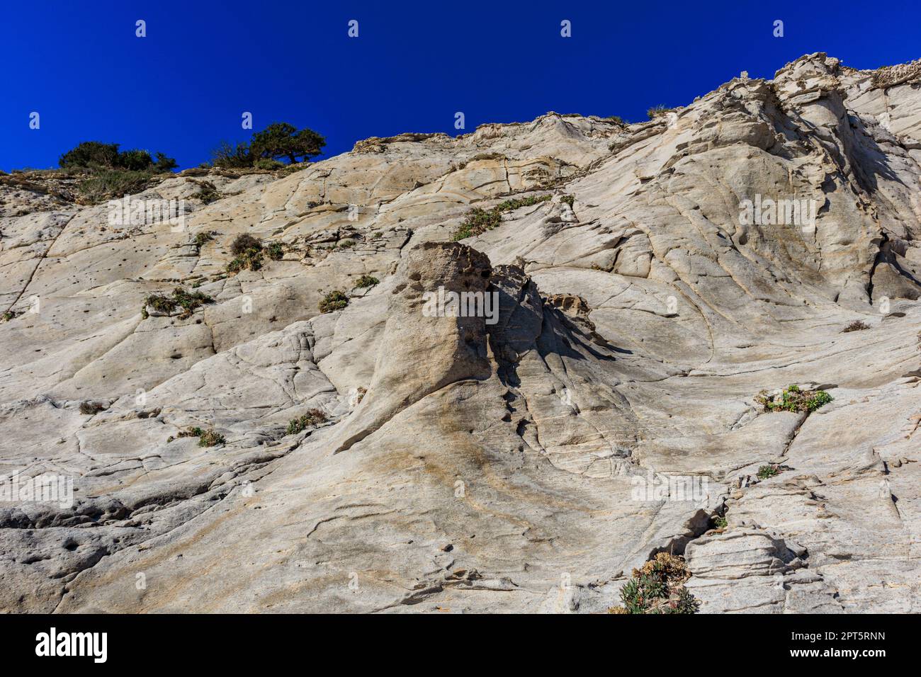 unusual rock formations of the volcanic cliff on Cala Sapone beach ...