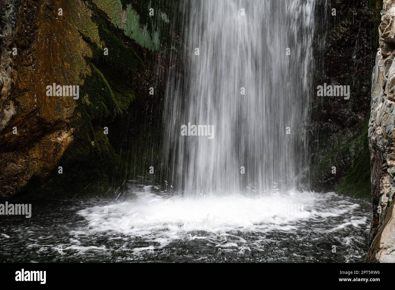 The Millomeris waterfall with rocks and splashing water close up, Pano ...