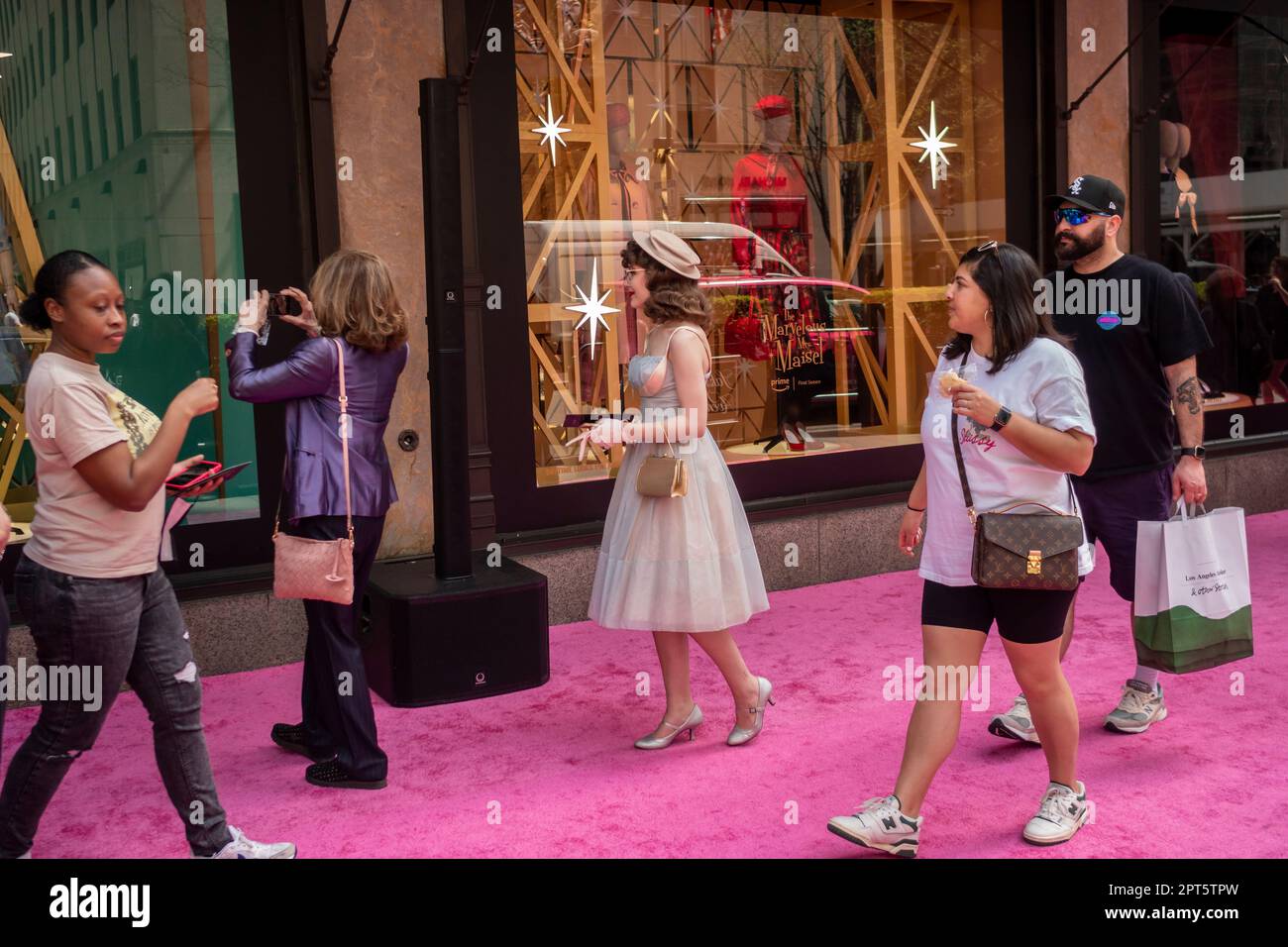 Hordes of fans and passer-by throng Fifth Avenue for an extensive brand ...