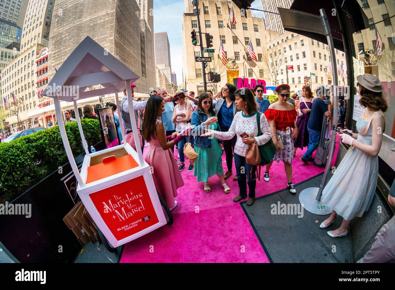 Hordes of fans and passer-by throng Fifth Avenue for an extensive brand ...