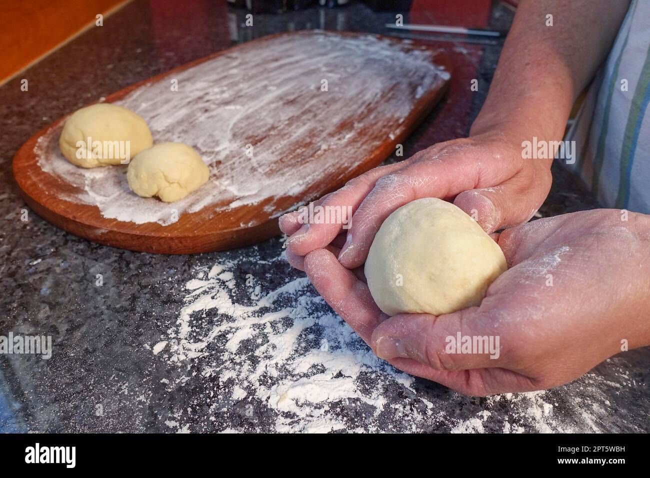 Swabian cuisine, preparing raised steam noodles, shaping yeast yeast ...