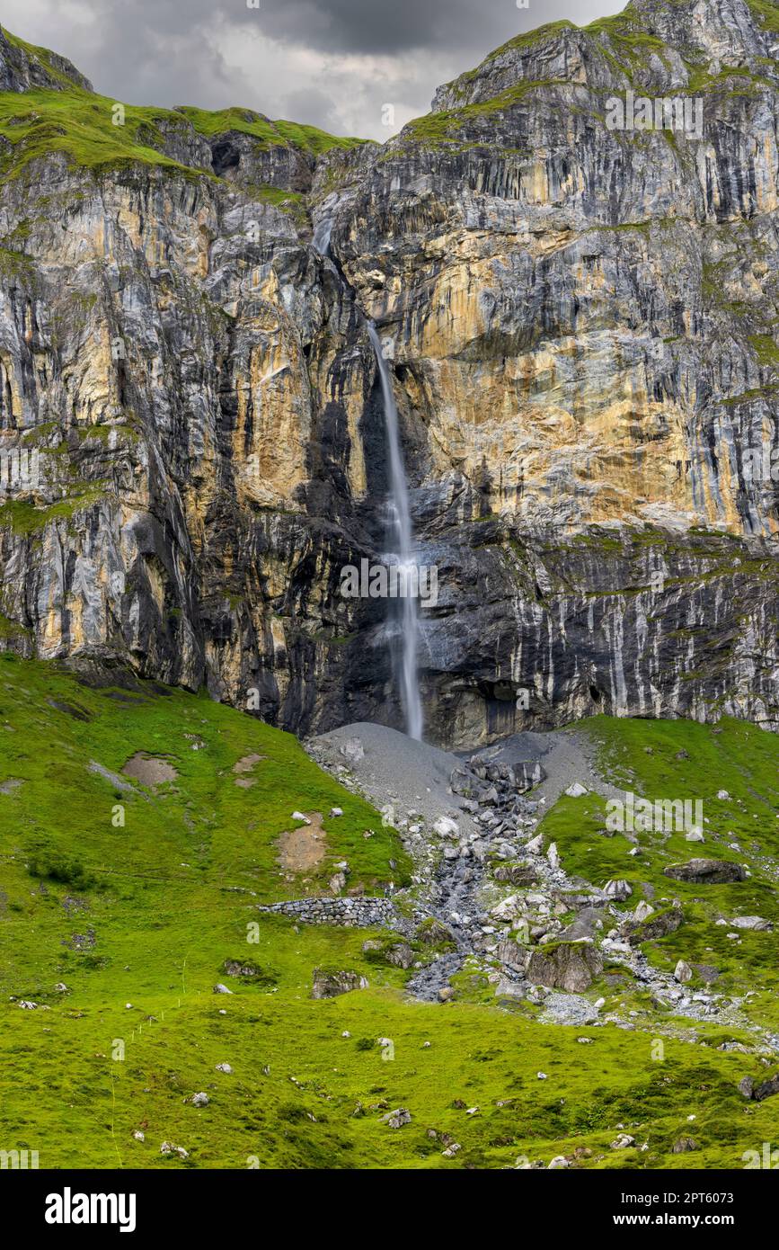 Typical alpine landscape with waterfalls, Swiss Alps near ...