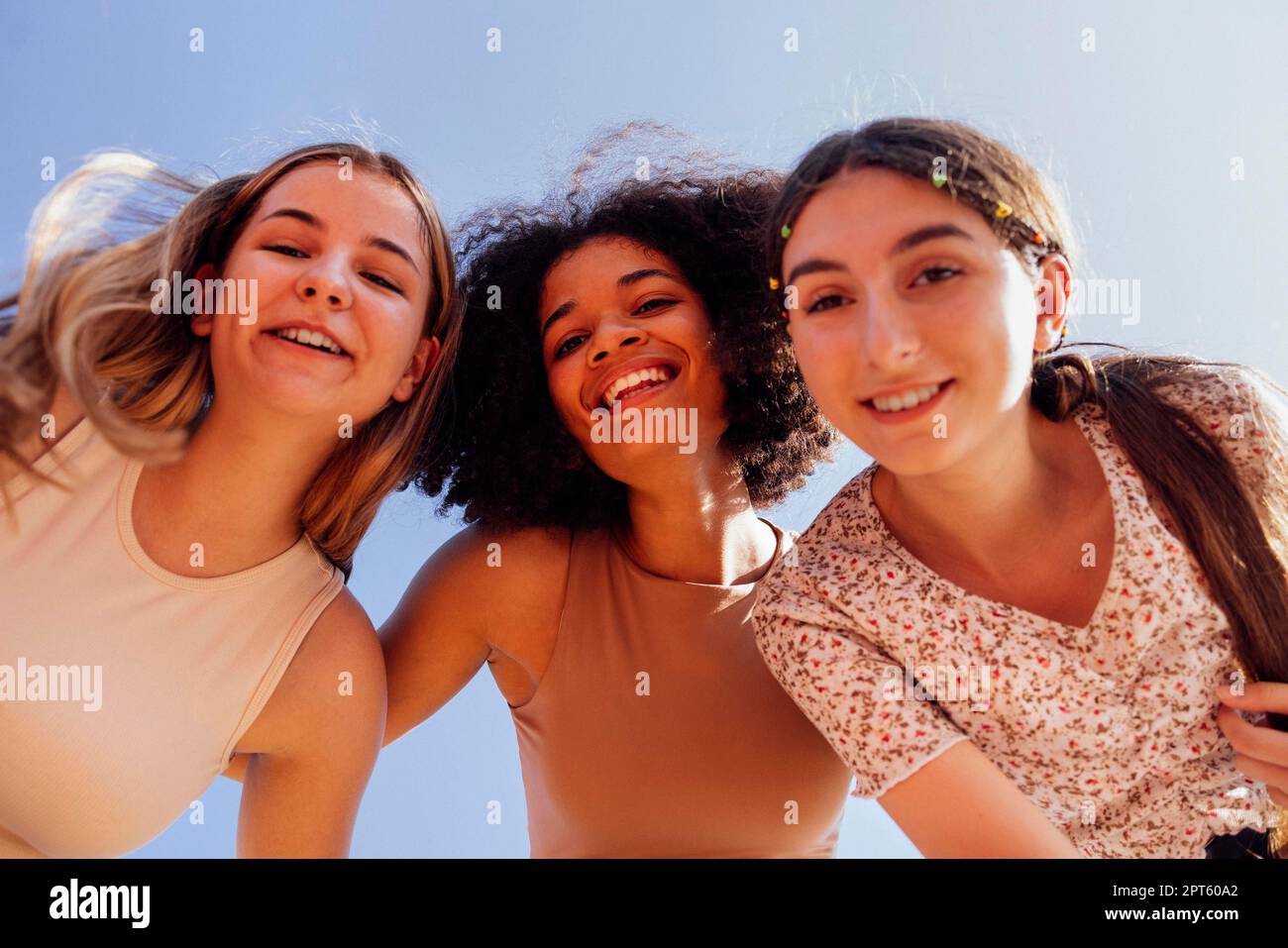 Group of teenagers of different nationalities and appearance have a fun ...