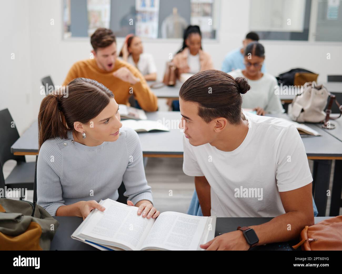 Teens talking book hi-res stock photography and images - Alamy