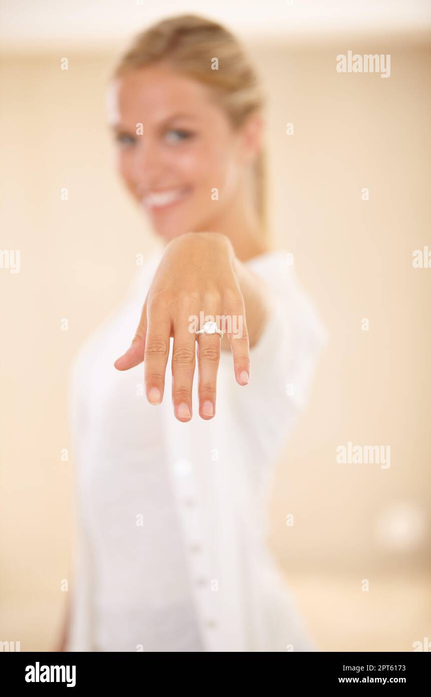 Im tying the knot. Portrait of a beautiful young woman showing off her ...