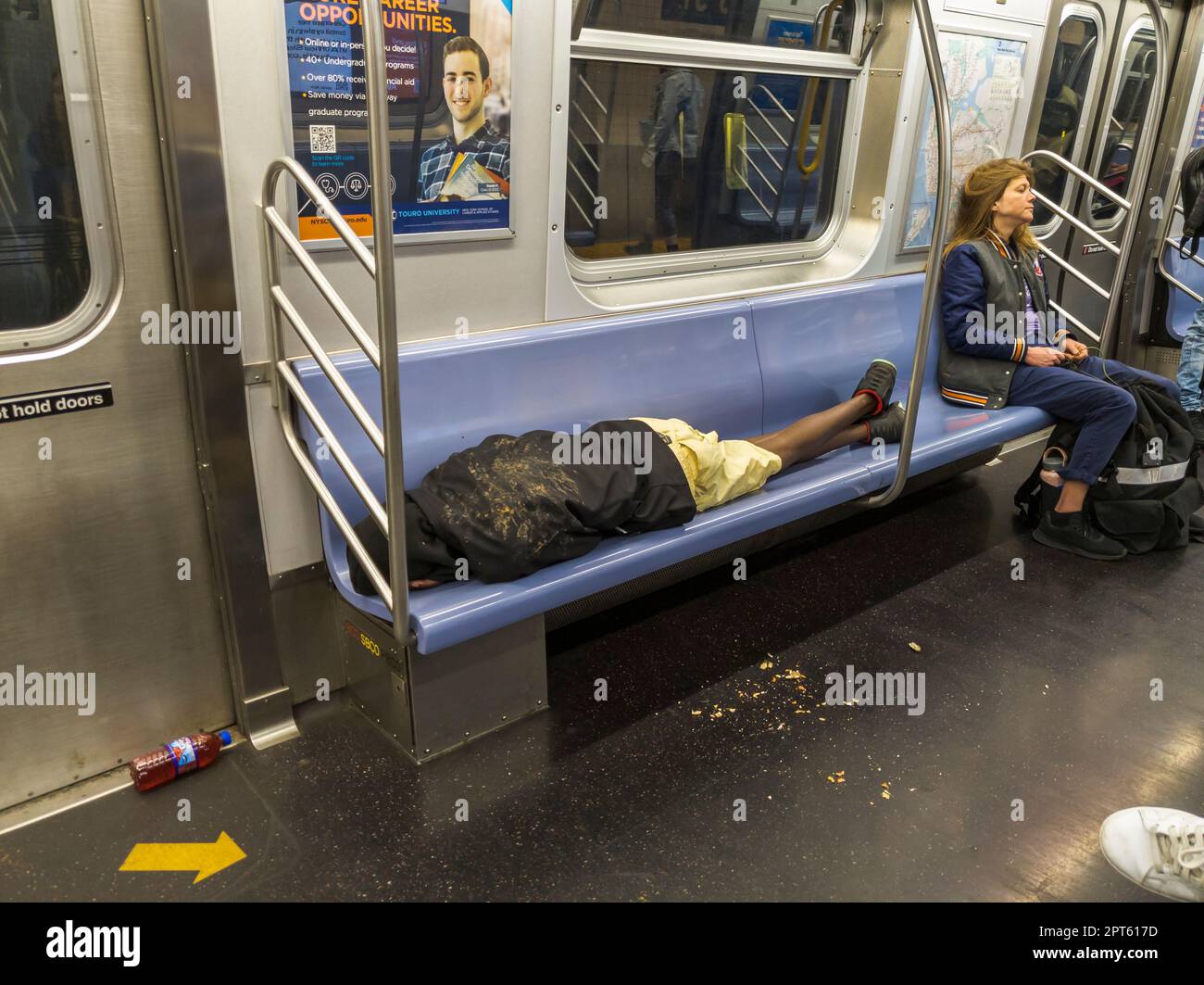 Homeless man sleeping in subway hi-res stock photography and images - Alamy