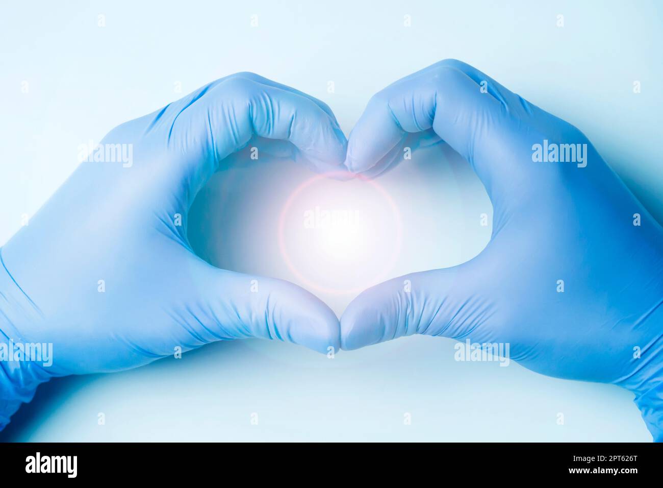 Doctor's hands show the symbol of heart Stock Photo - Alamy