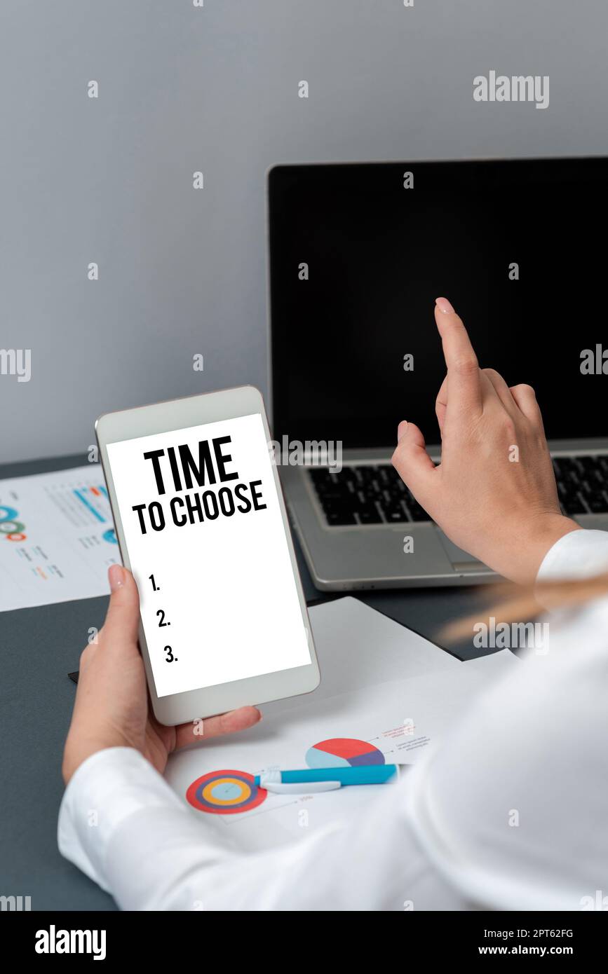 Sign displaying Time To ChooseJudging the merits of multiple options ...