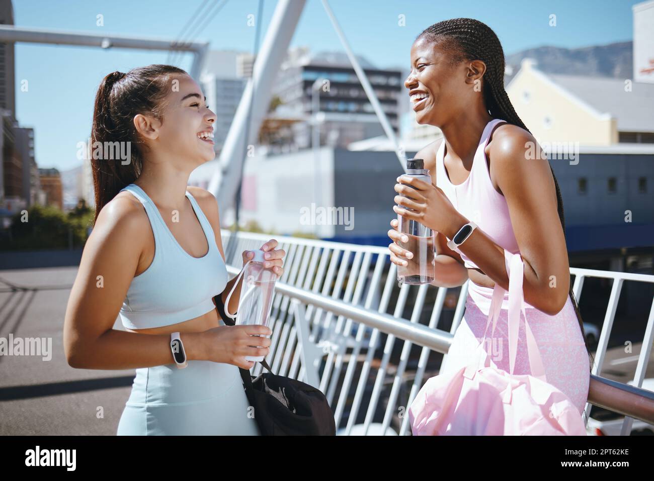 Diversity, fitness and friends laughing while drinking water to hydrate ...
