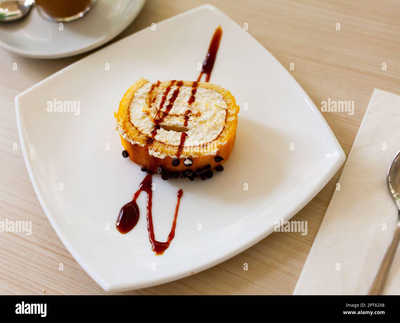 Delicious roll sponge cake with vanilla cream Stock Photo - Alamy