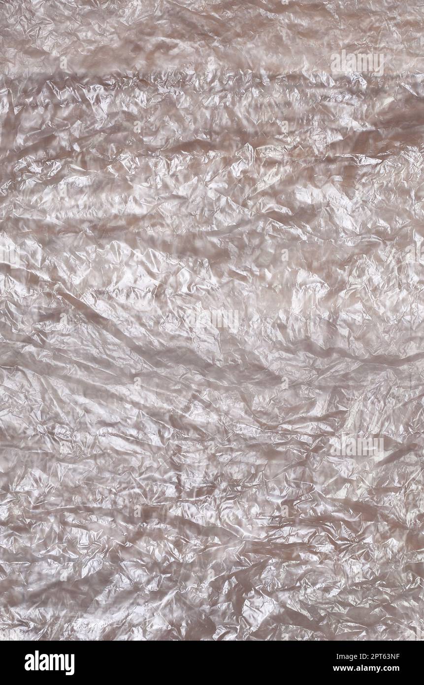 Texture of white crumpled cellophane surface transparent on sunlight ...