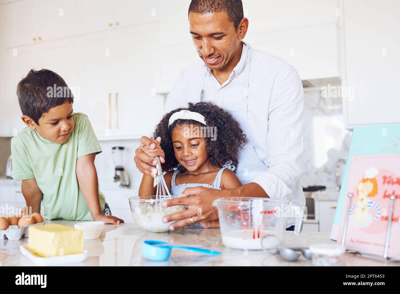 Family, children and baking with a girl and boy learning about cooking ...