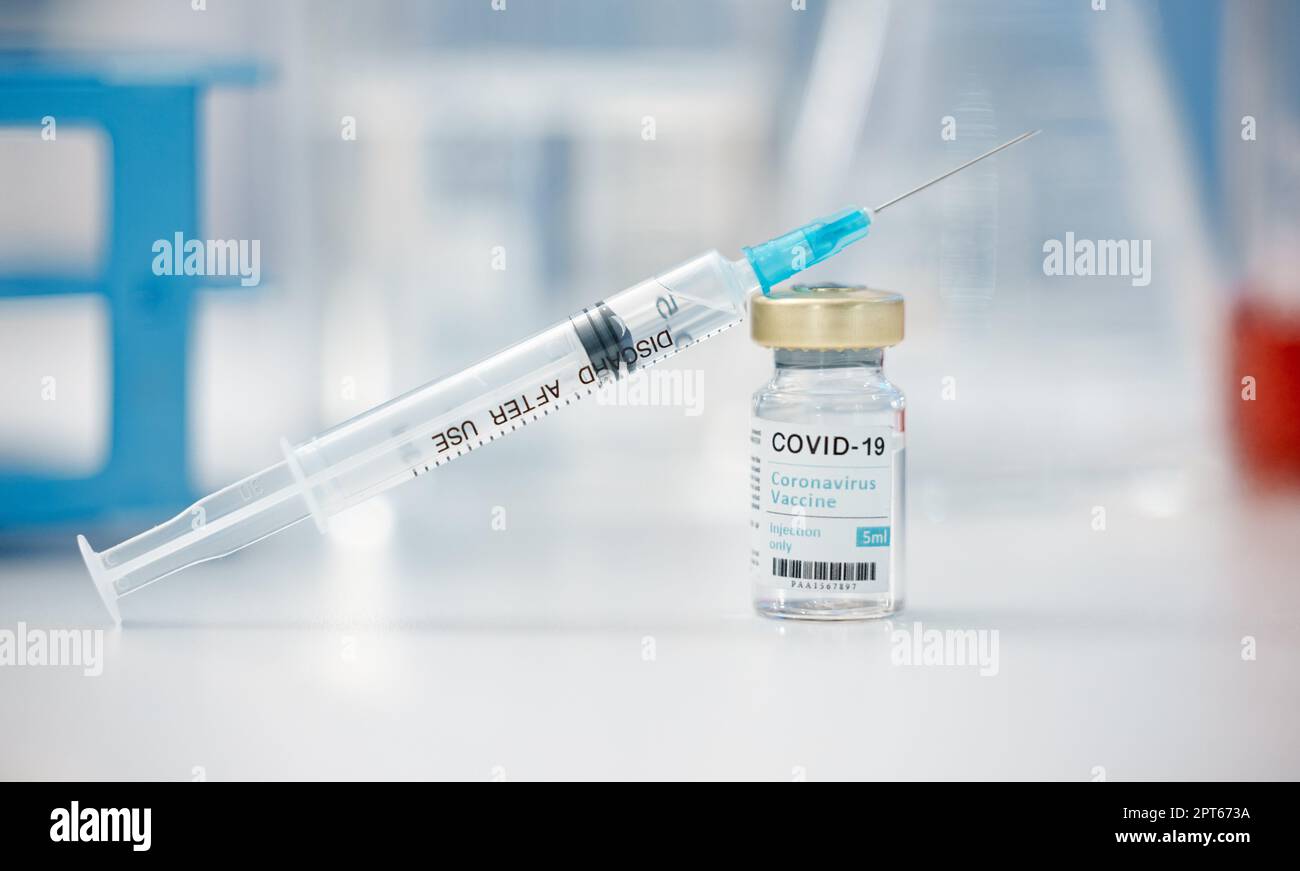 The cure for everything. an empty laboratory with a needle and vial on ...