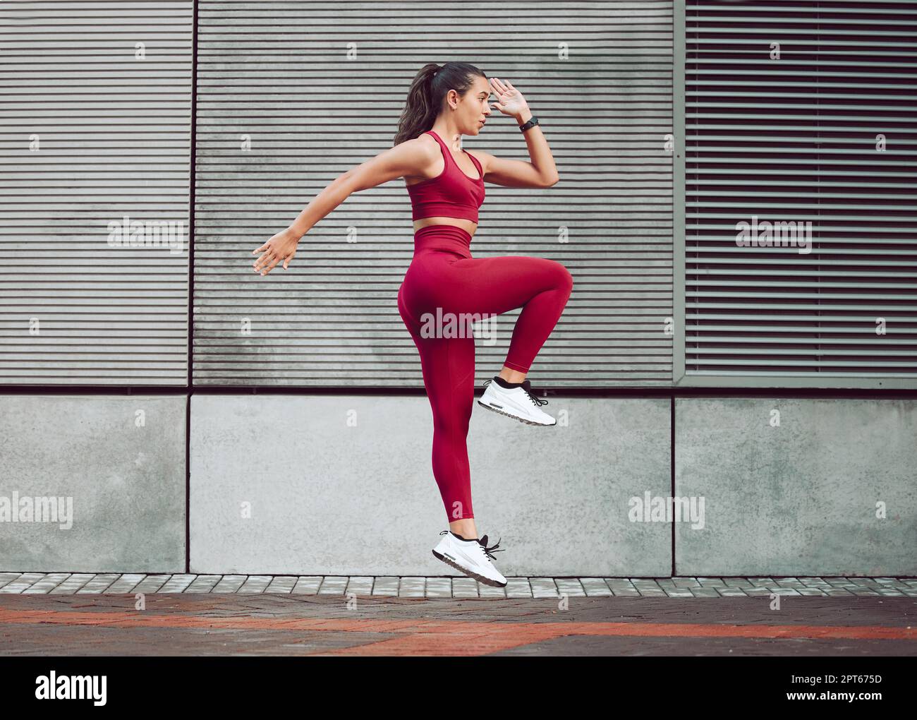 Ready to run. Full length shot of an attractive young female athlete running outdoors Stock ...
