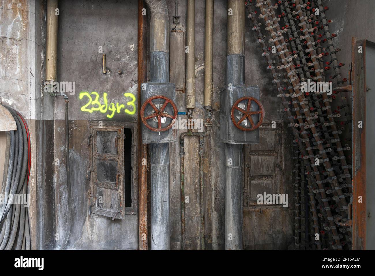 Stop wheels on pipelines in a former paper factory, Bavaria, Germany ...