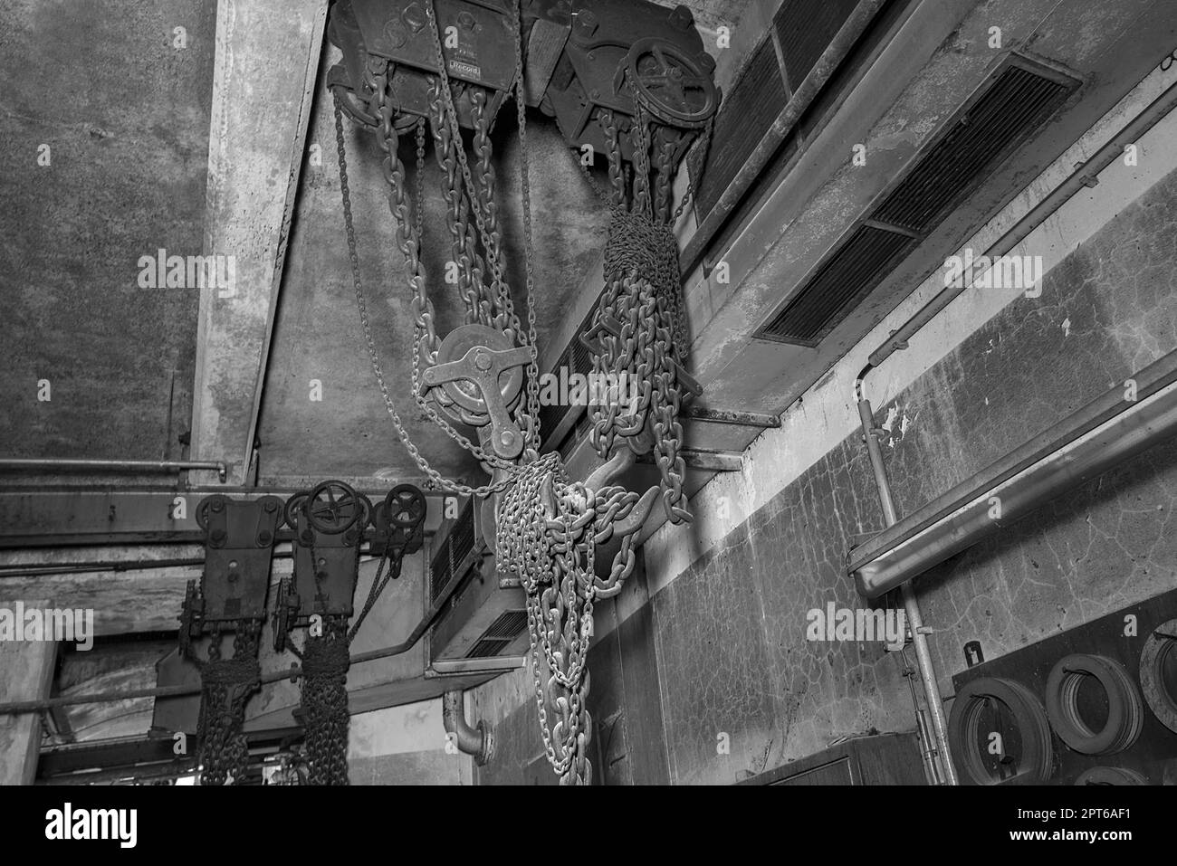 Chains from a pulley block of a former paper factory, Lost Place, Baden ...