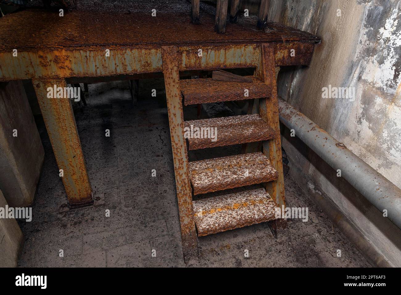 Rusty metal stairs in a former paper factory, Lost Place, Bavaria ...