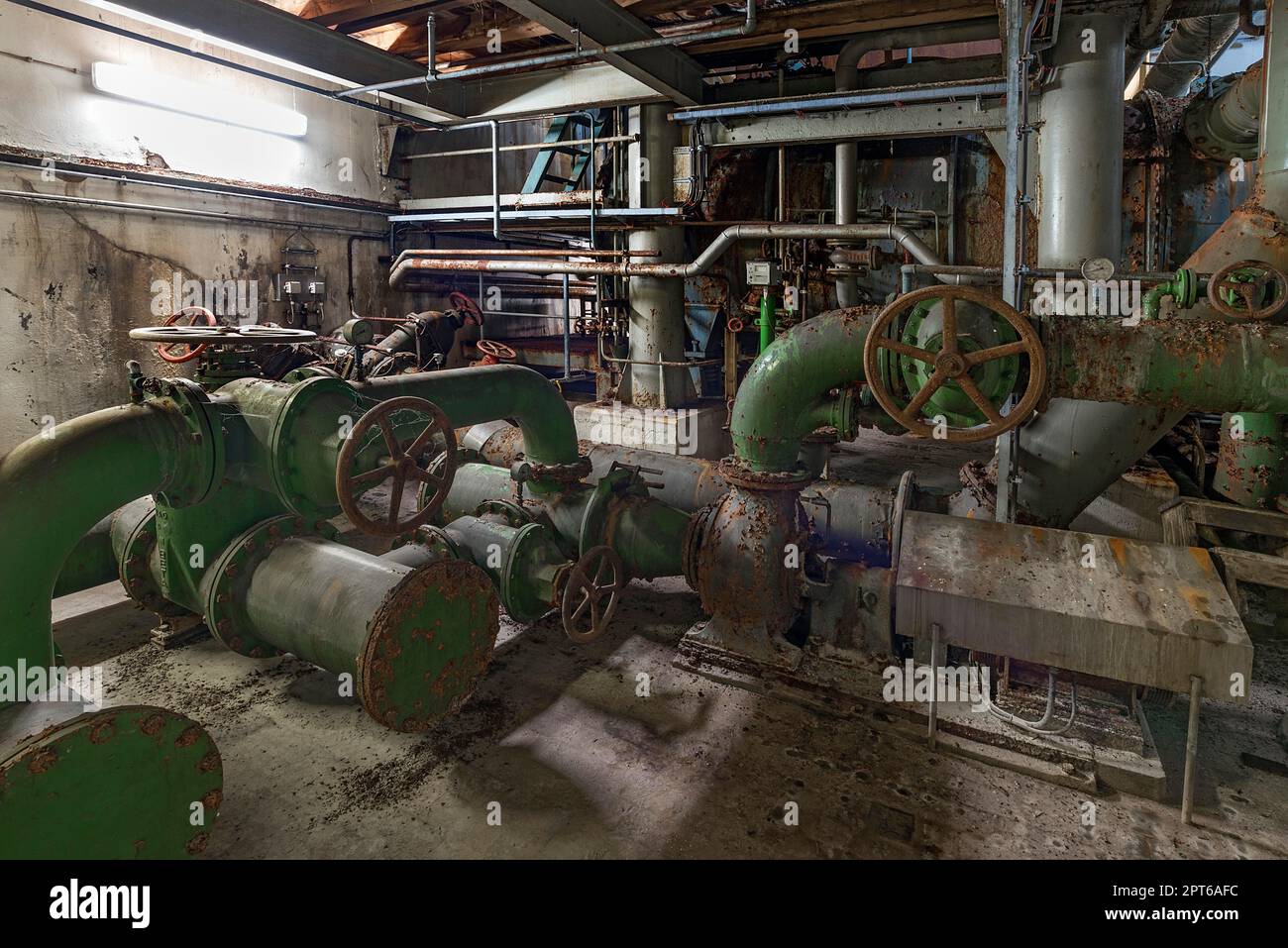 Water pipes in a machine room of a former paper factory, Lost Place ...