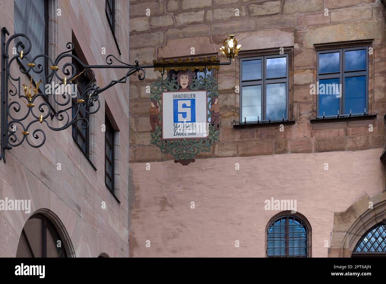 Historical nose sign on a residential and commercial building, Burgstr ...