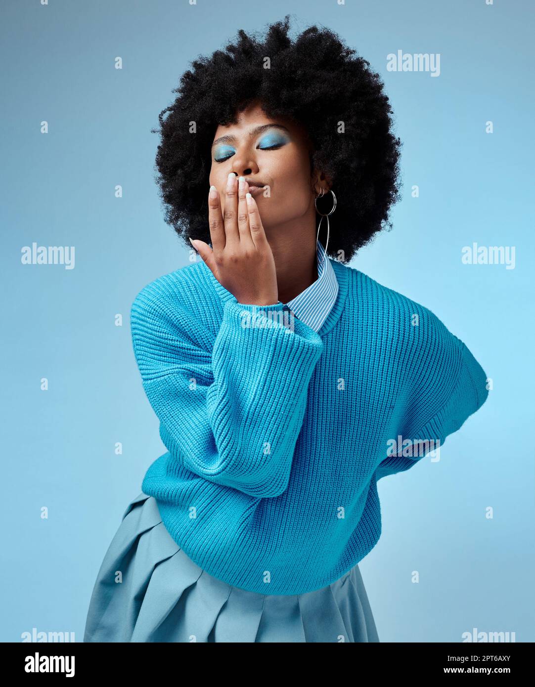 Girl, blue and background with clothes for fashion with hand, face and ...