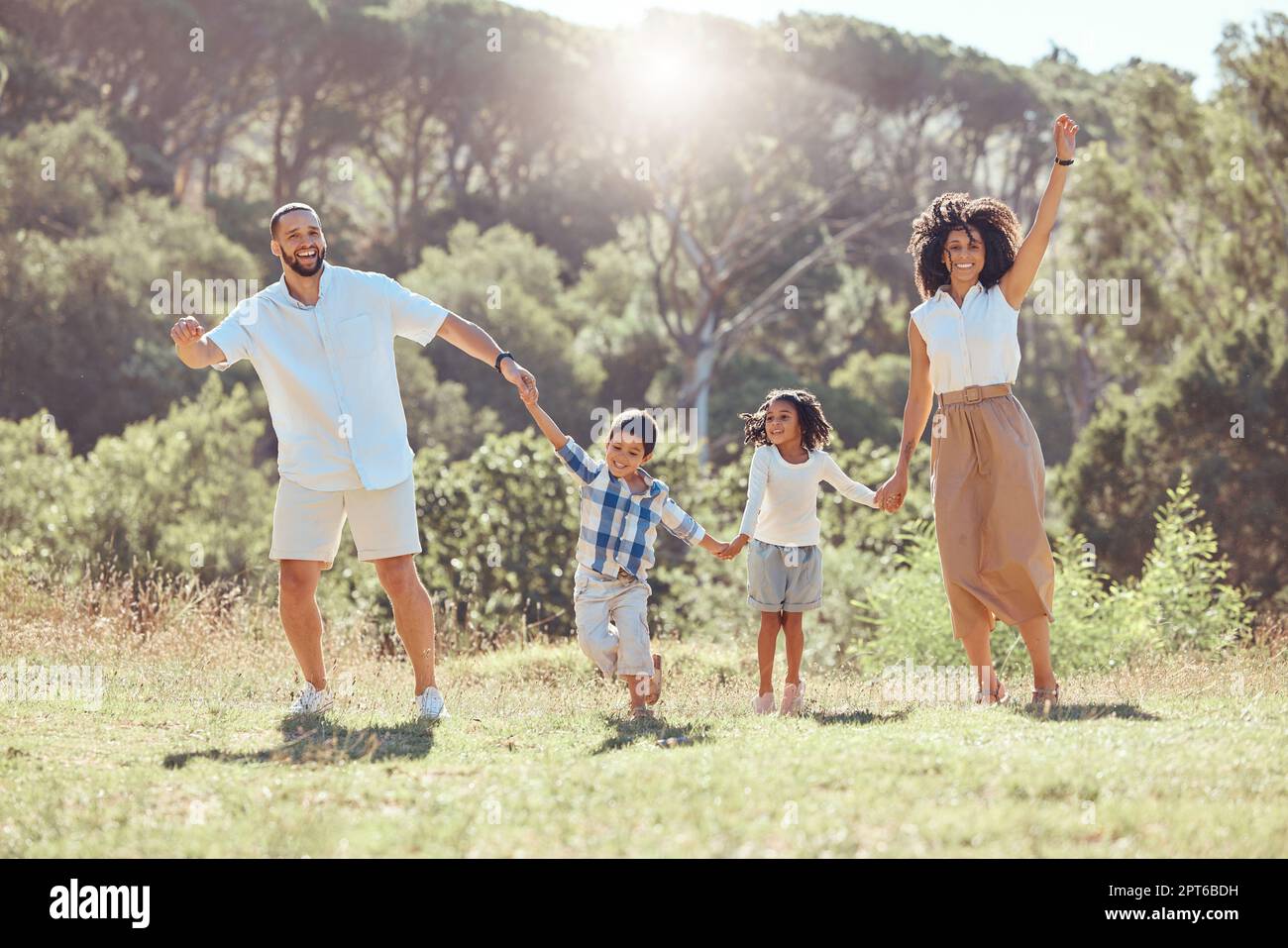 Happy family, kids and walking in nature holding hands, spending ...