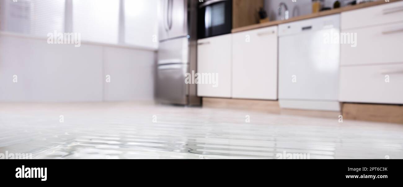 Tile Kitchen Floor Inside Home With Leak And Flood Stock Photo - Alamy