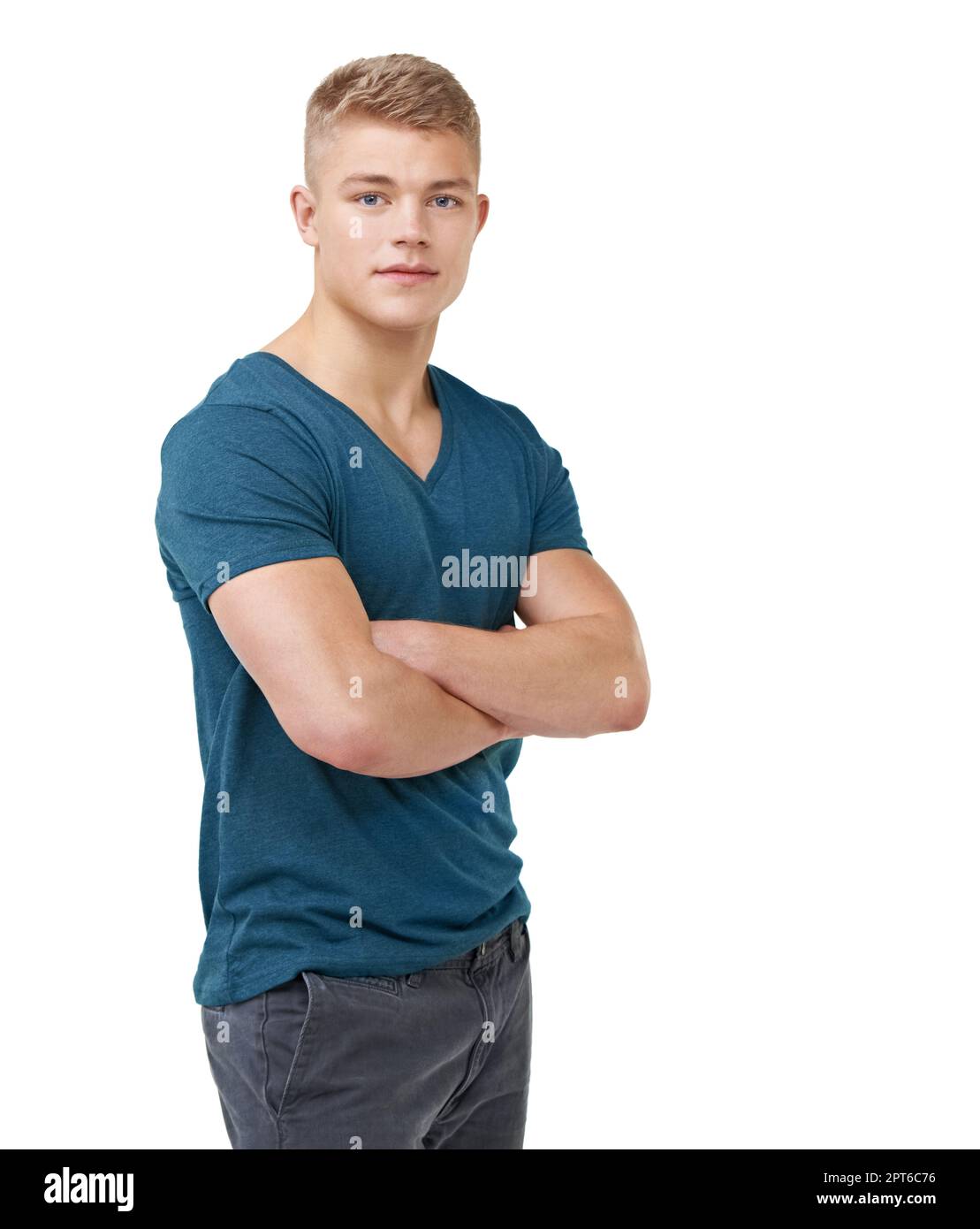 Fashionable and handsome. A handsome young man crossing his arms and ...