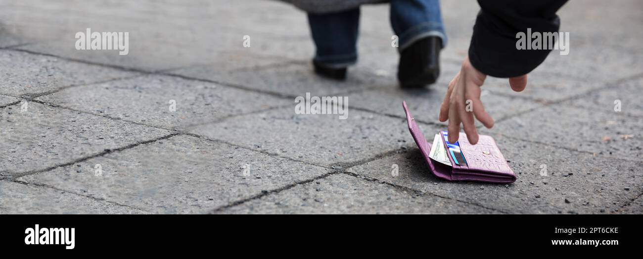 Lost Leather Wallet. Man Picks Money. Thief Hand Stock Photo - Alamy