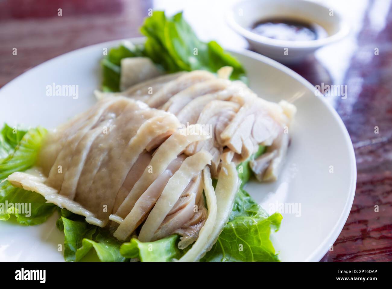 Slice of steamed chicken on plate Stock Photo - Alamy