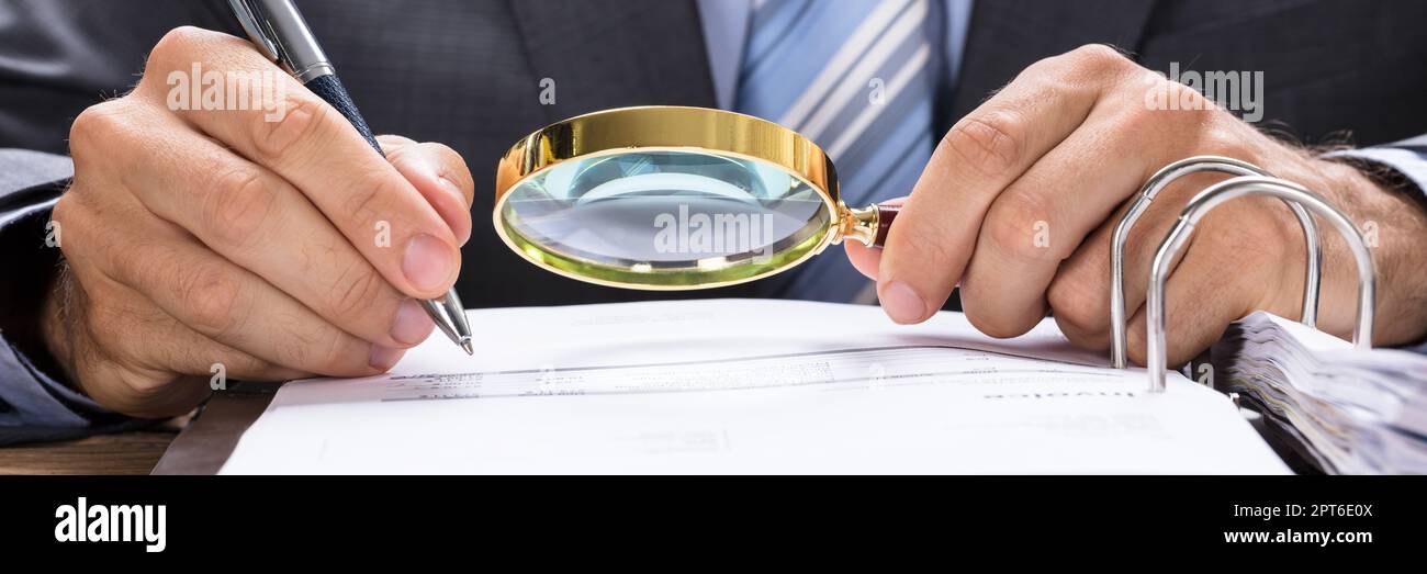 Internal Business Budget Audit Using Magnifying Glass Stock Photo - Alamy