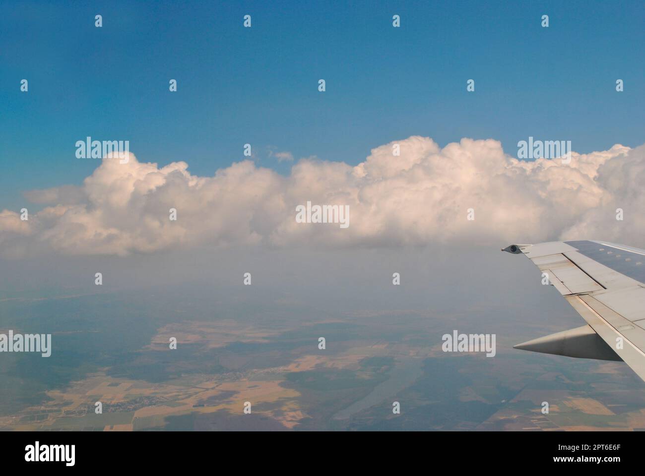 flying high in the blue sky above white clouds. landscape of earth from ...