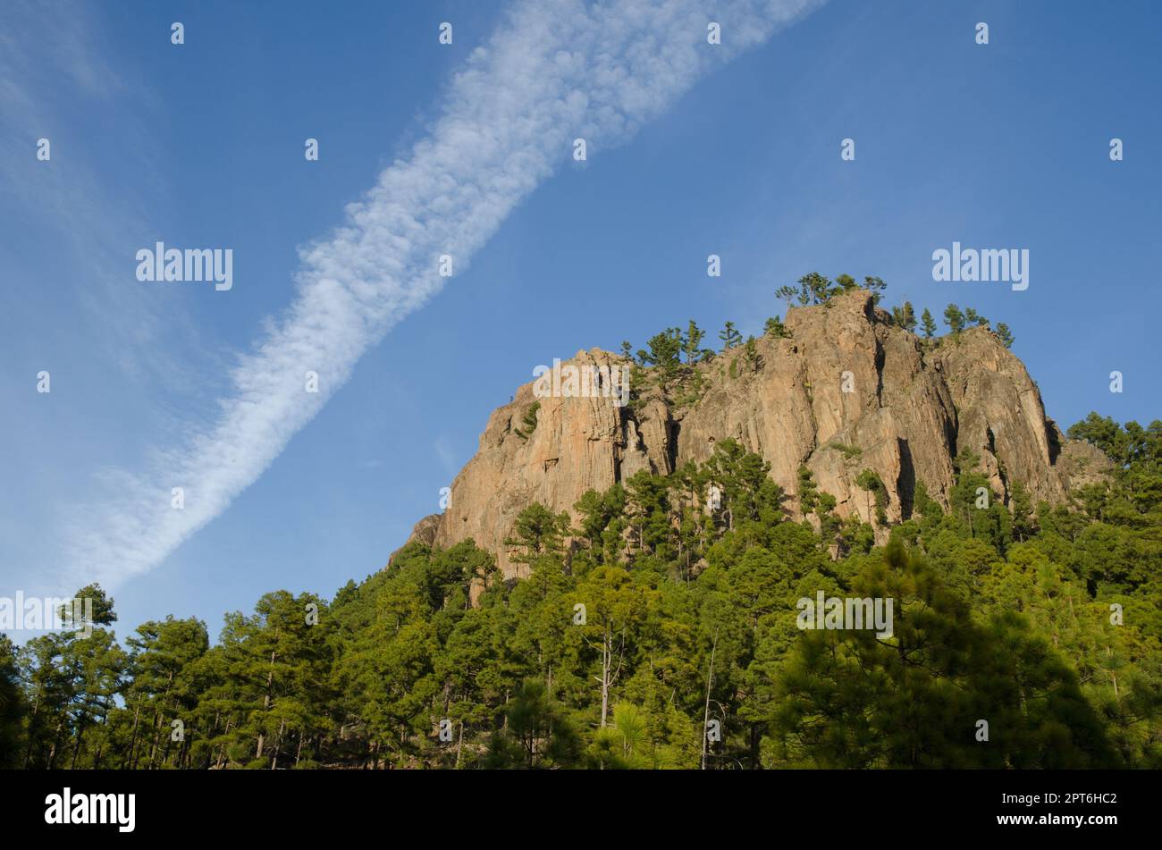 Cliff of the Morro de Pajonales and vapor trail of an aircraft ...