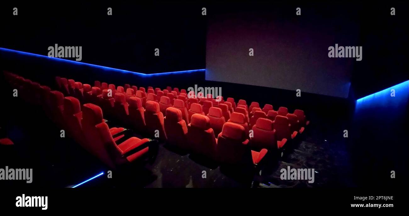 Empty cinema hall with red seats. Interior of modern movie theatre ...