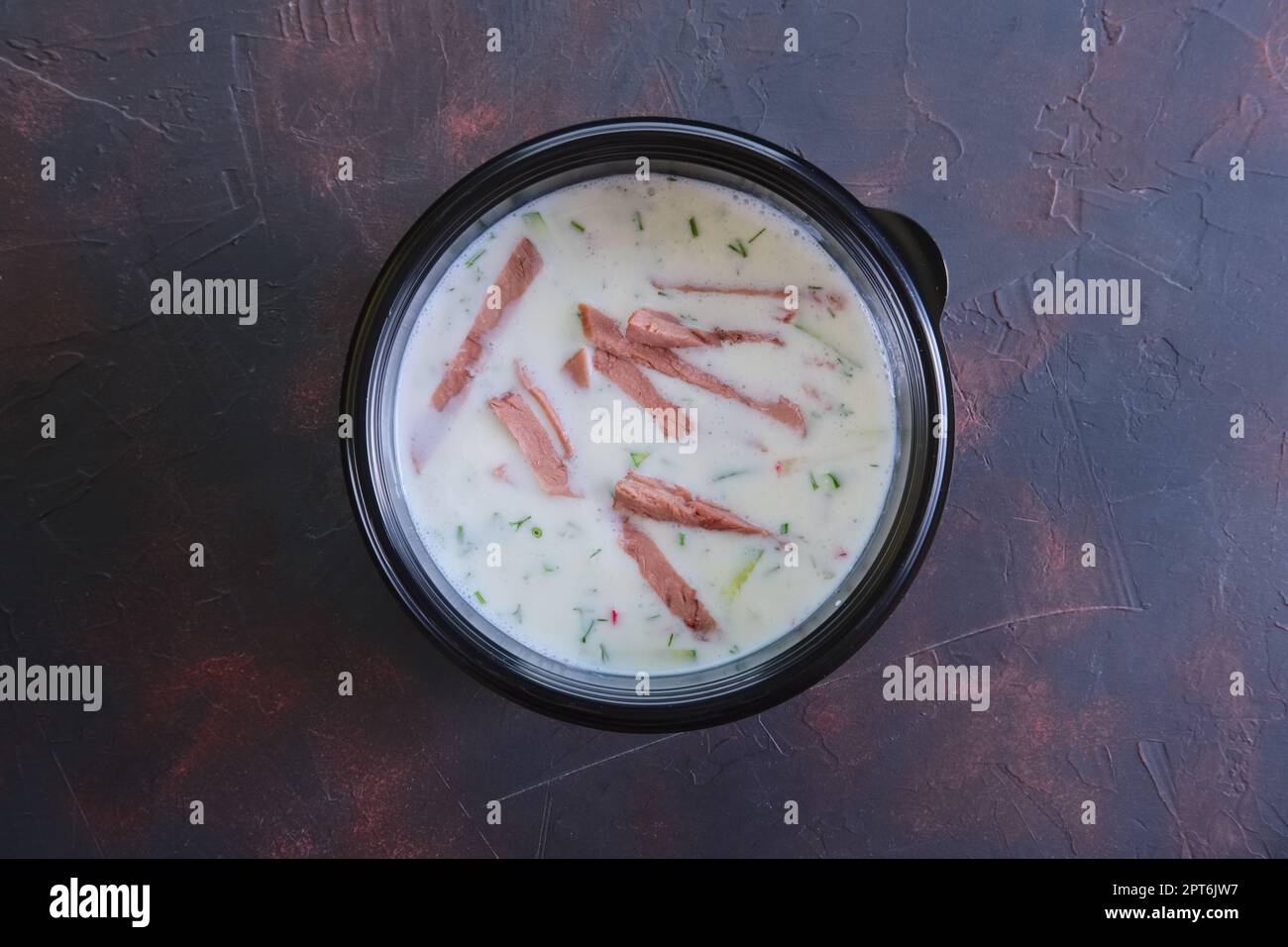 Traditional cold belorussian soup with beef, cucumber, radish and kefir ...