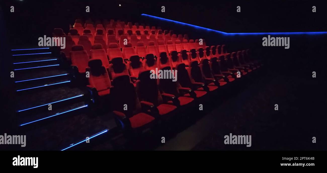 Empty cinema hall with red seats. Interior of modern movie theatre ...