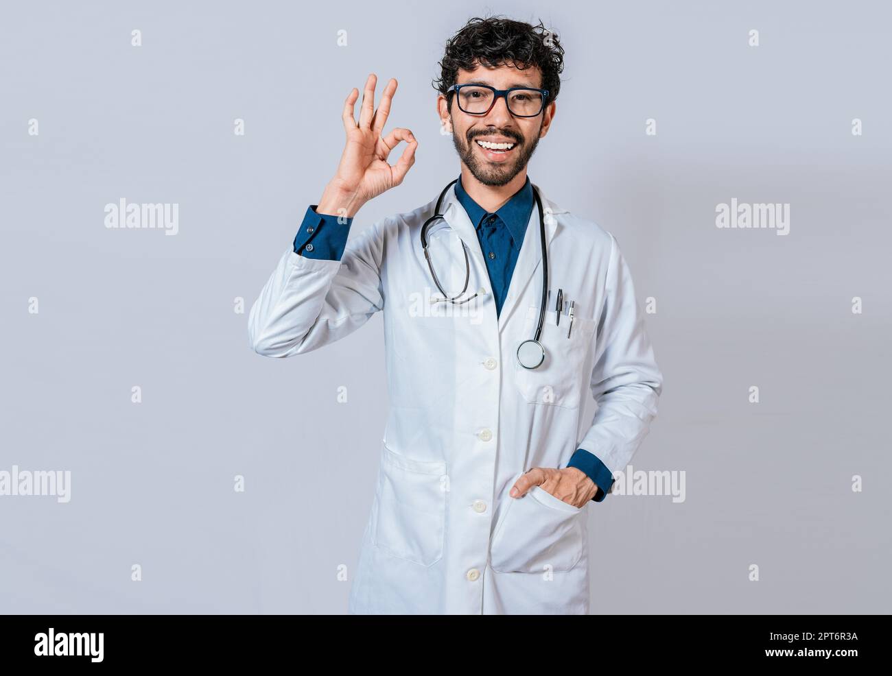Happy doctor gesturing approval isolated. Handsome doctor approving and ...