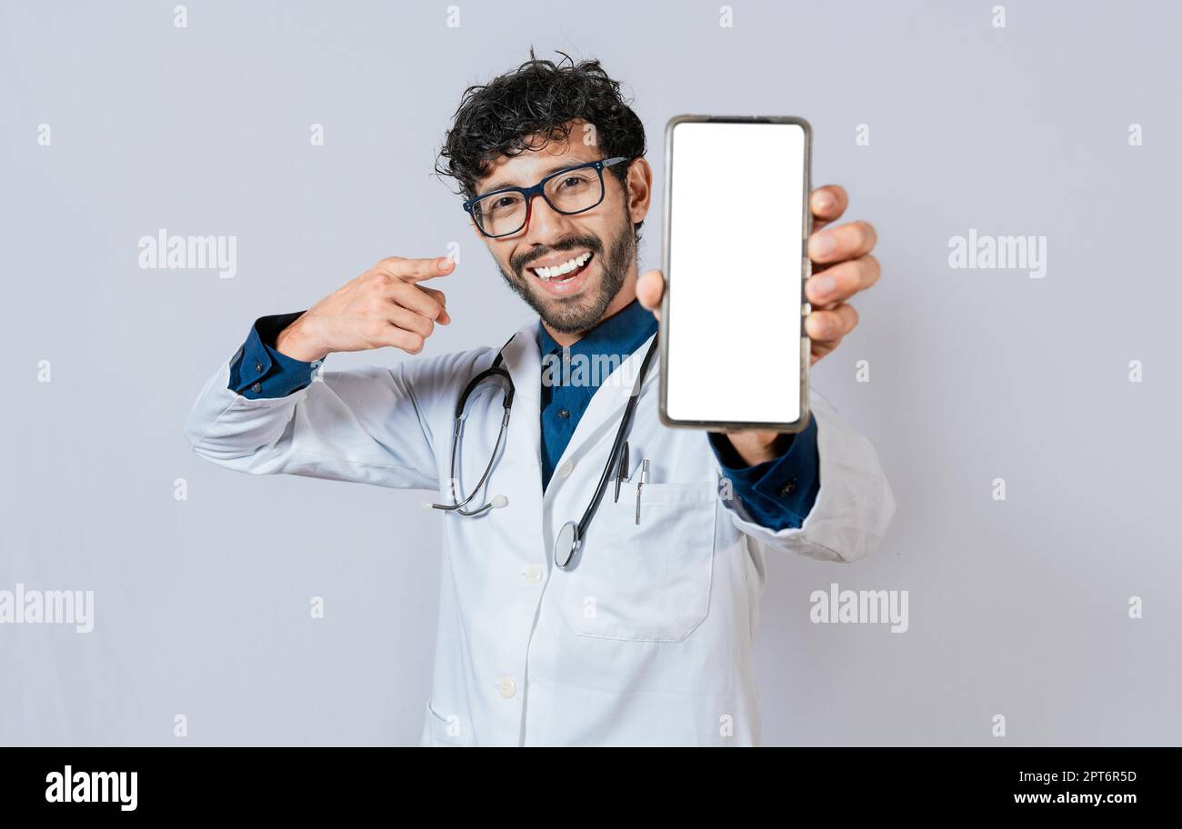 Happy doctor showing cell phone screen to camera. Smiling doctor ...