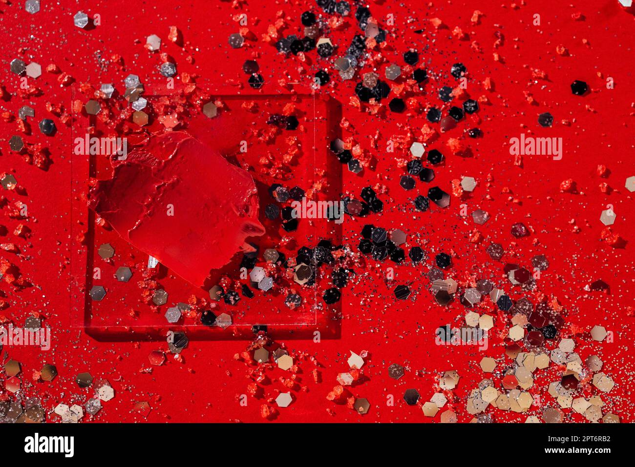 Cosmetics smear of smudged red lipstick on transperent glass. Bright ...