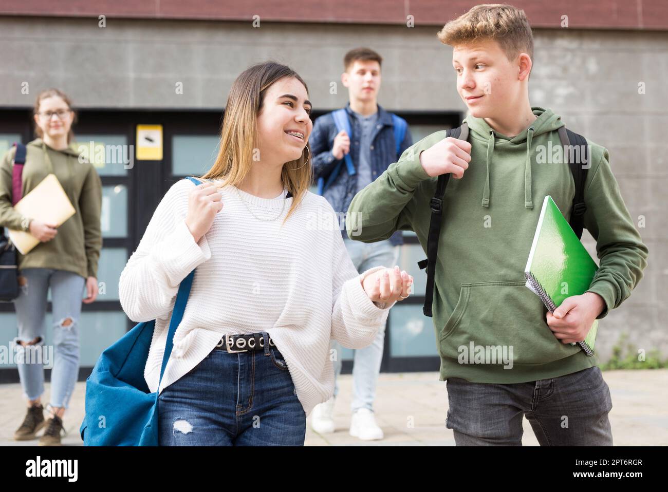 Carefree teen students boy and girl friendly talking Stock Photo - Alamy