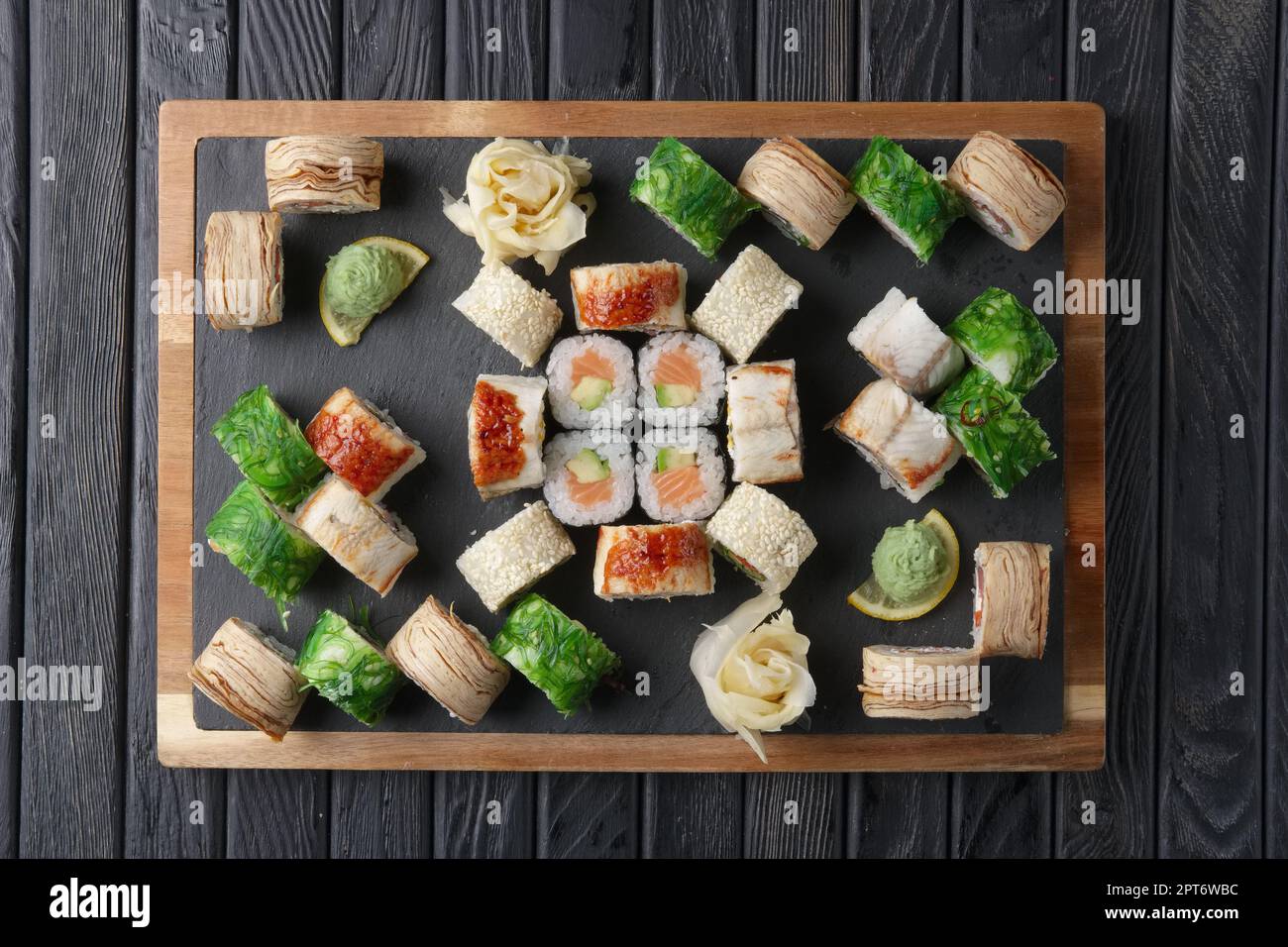Big set of rolls served on stone plate. Layout for menu Stock Photo - Alamy